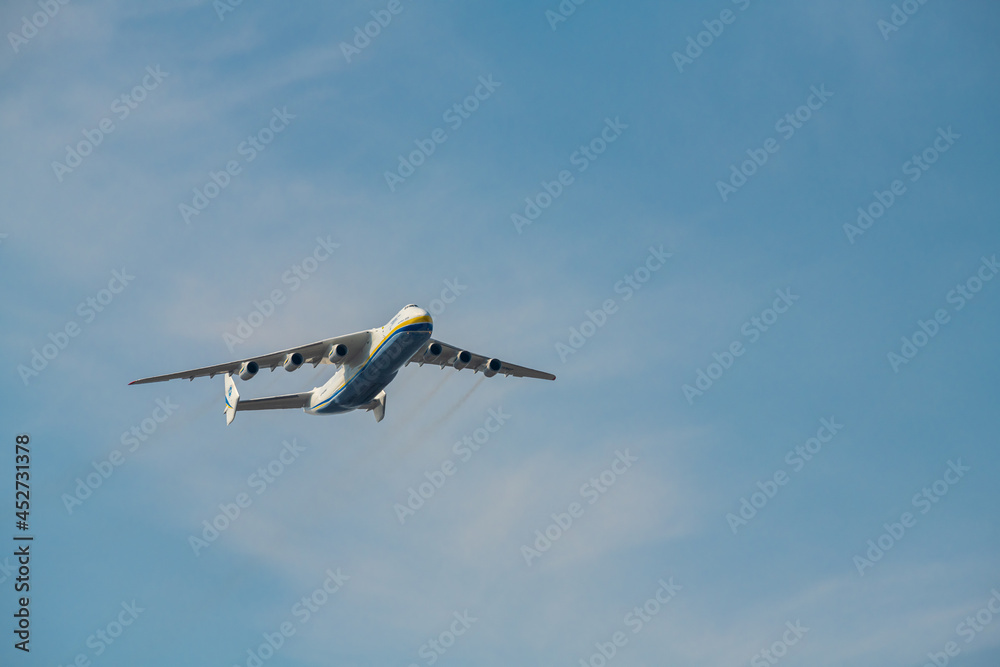 Aircraft Antonov An-225 Mriya flying in blue sky under the Kiev during ...