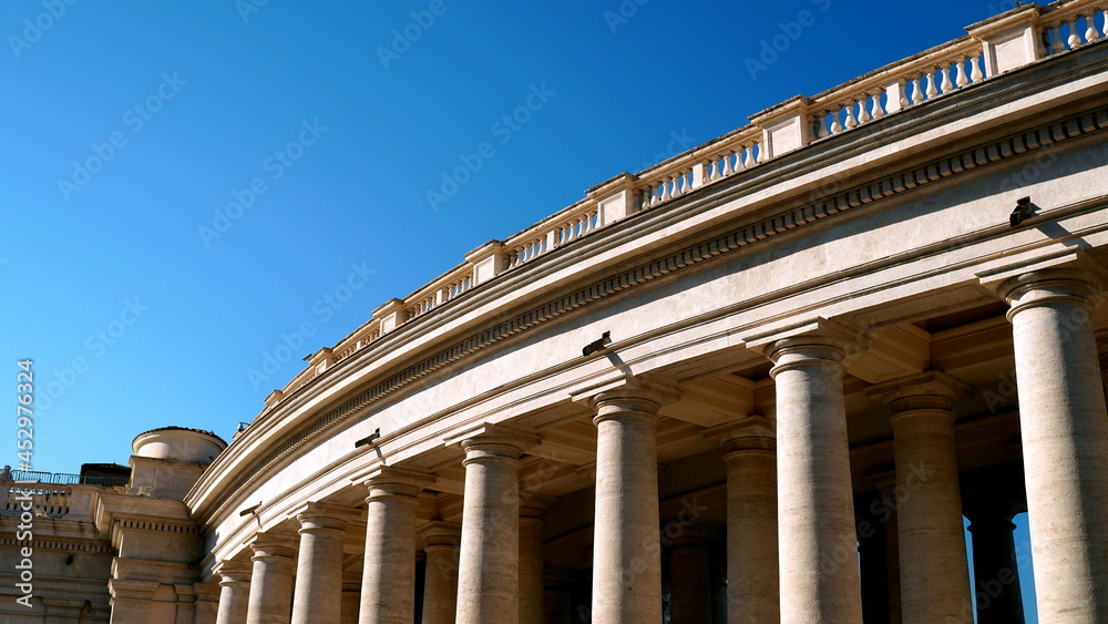 Colonnade of St. Peter's Basilica seen in perspective from below ...