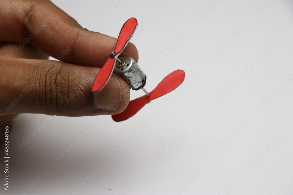 Small dual shaft dc motor with propellers attached to its shaft. Mini ...