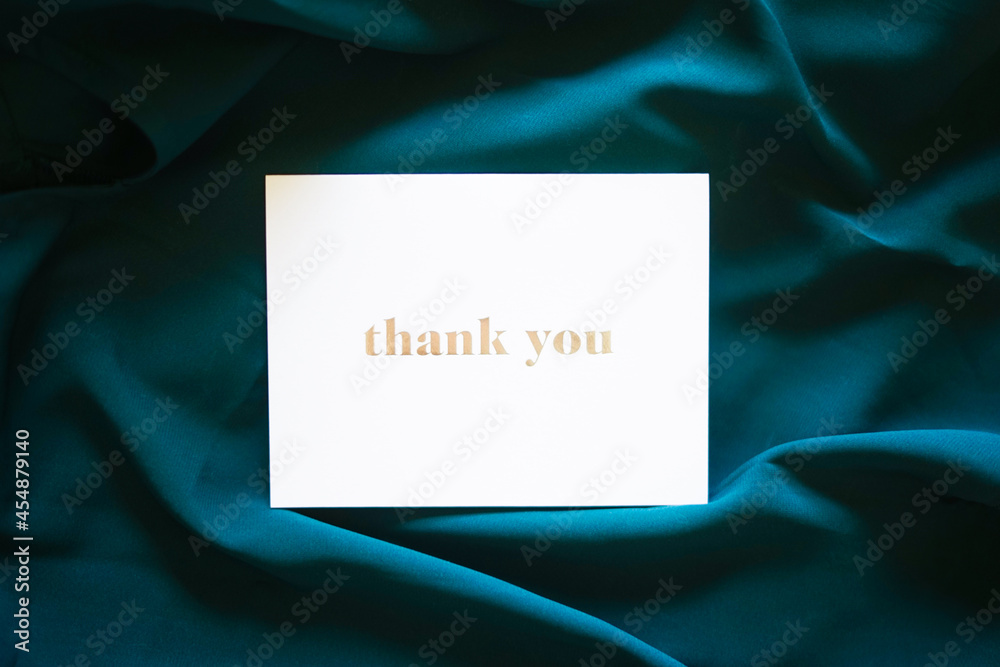 Thank you card on dark green silk background. Elegant luxury satin ...
