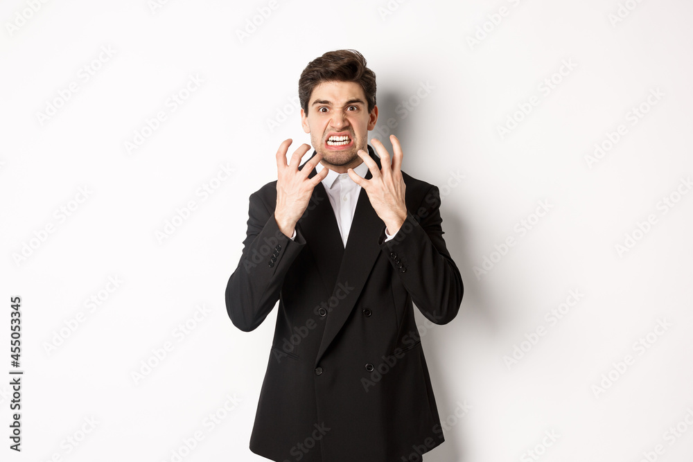 Image of angry businessman in suit, looking with furious expression and ...