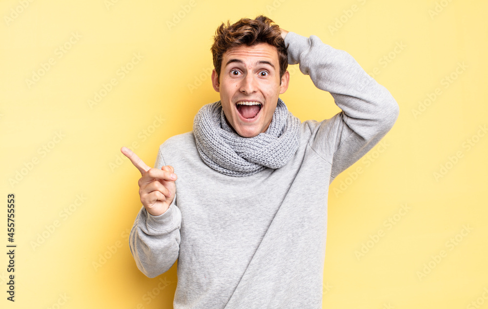 young teenager boy laughing, looking happy, positive and surprised ...