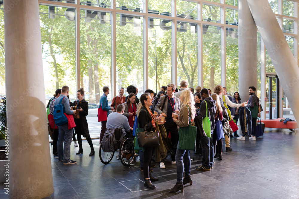 People talking during conference break Stock Photo | Adobe Stock