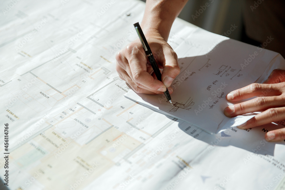 Working with plans and architectural drawings for renovation Stock ...