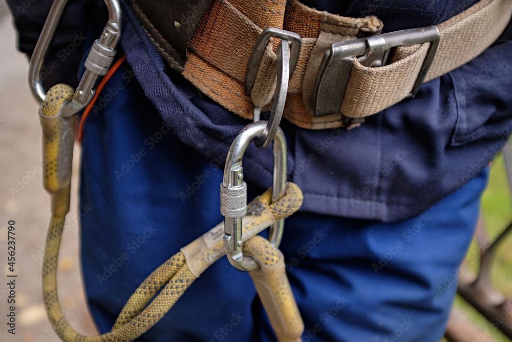Man with safety equipment at work in the heights, safety body ...