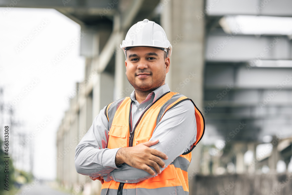 Asian engineer handsome man or architect looking construction with ...