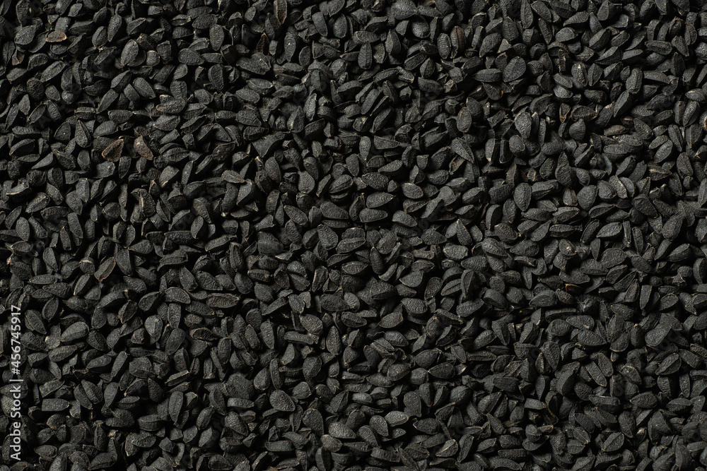 food background of kalonji seeds, top view Stock Photo | Adobe Stock