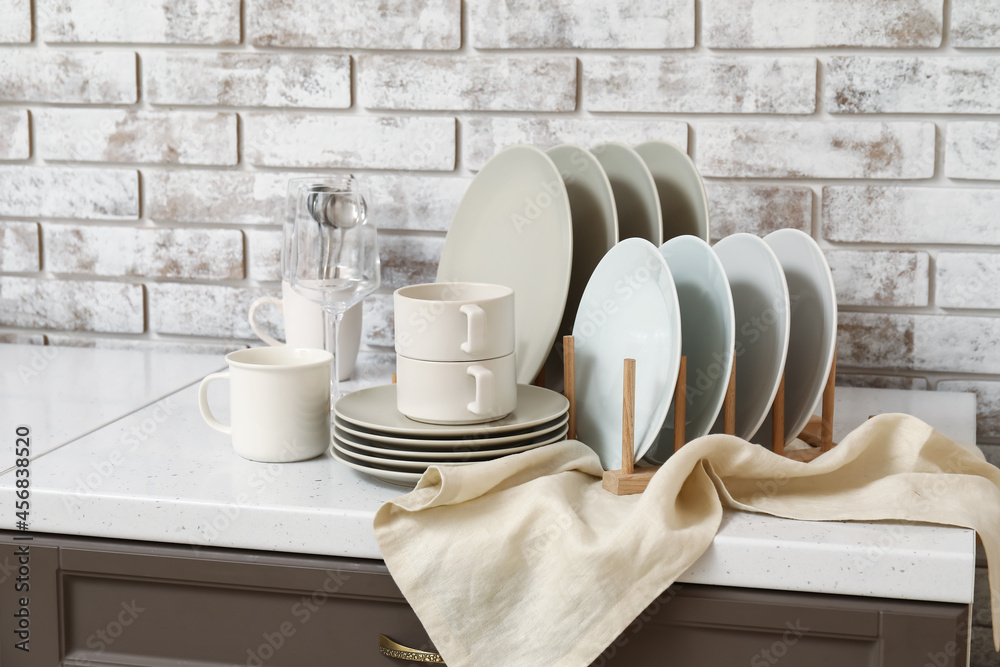 Set of clean dishes on counter in kitchen Stock Photo | Adobe Stock