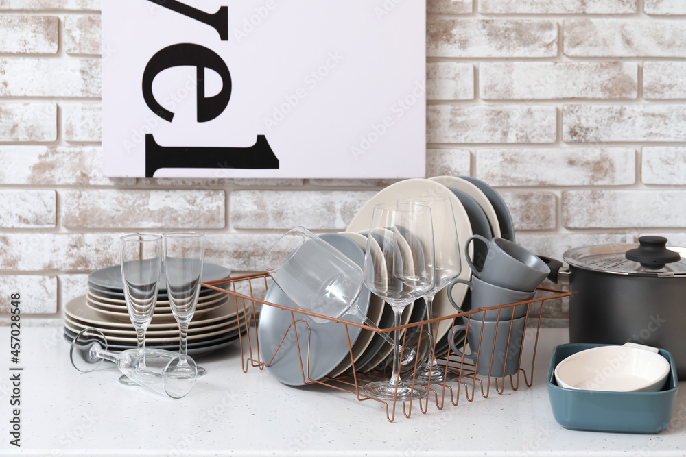 Set of clean dishes on counter in kitchen Stock Photo | Adobe Stock