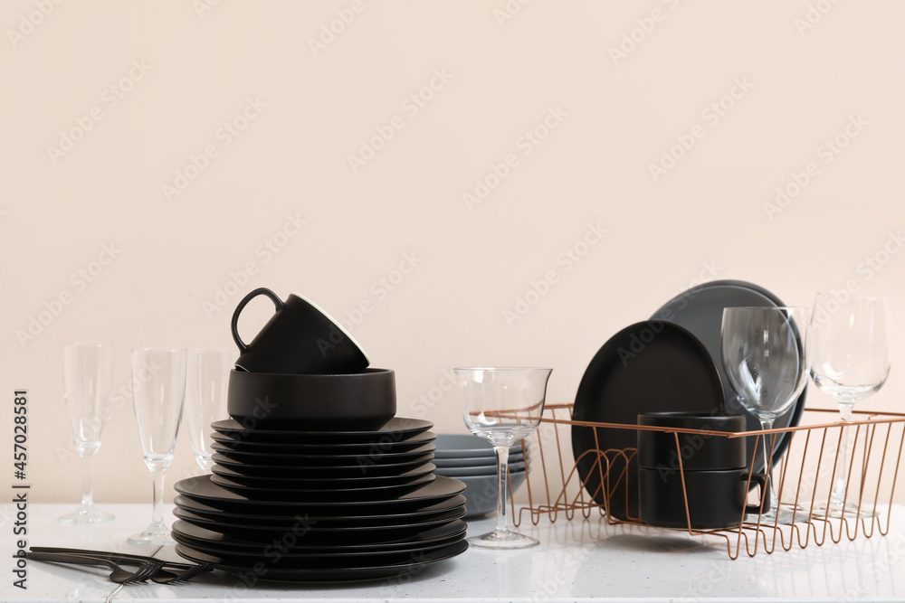 Set of clean dishes on light background Stock Photo | Adobe Stock