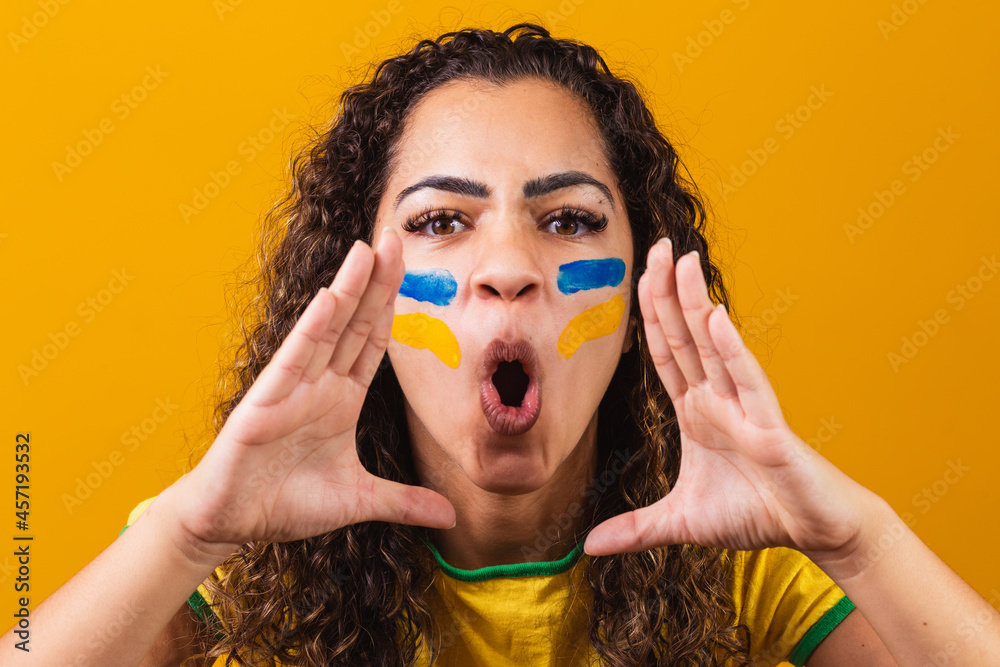 brazilian fan with her face painted in blue and yellow for the brazil ...