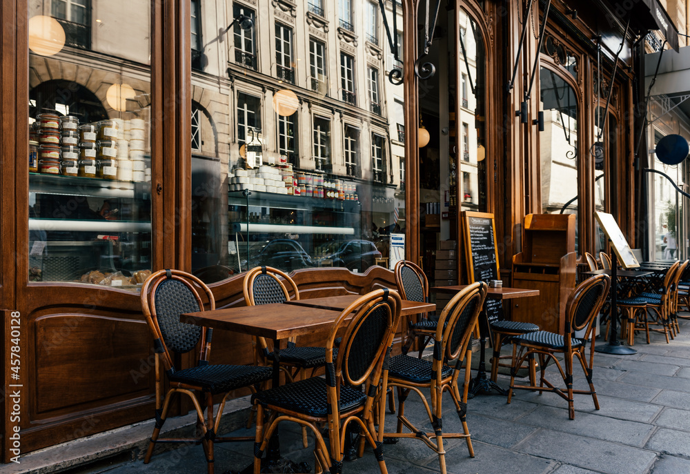 Typical view of the Parisian street with tables with tables of cafe in ...
