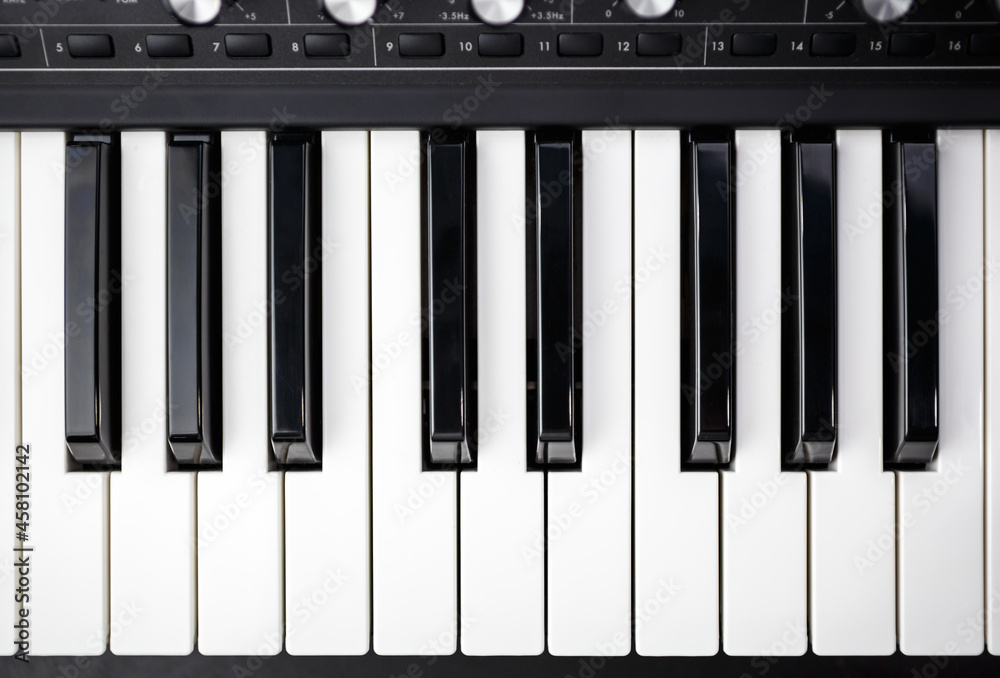 Analog synthesizer piano keyboard in flat lay. Professional synth ...