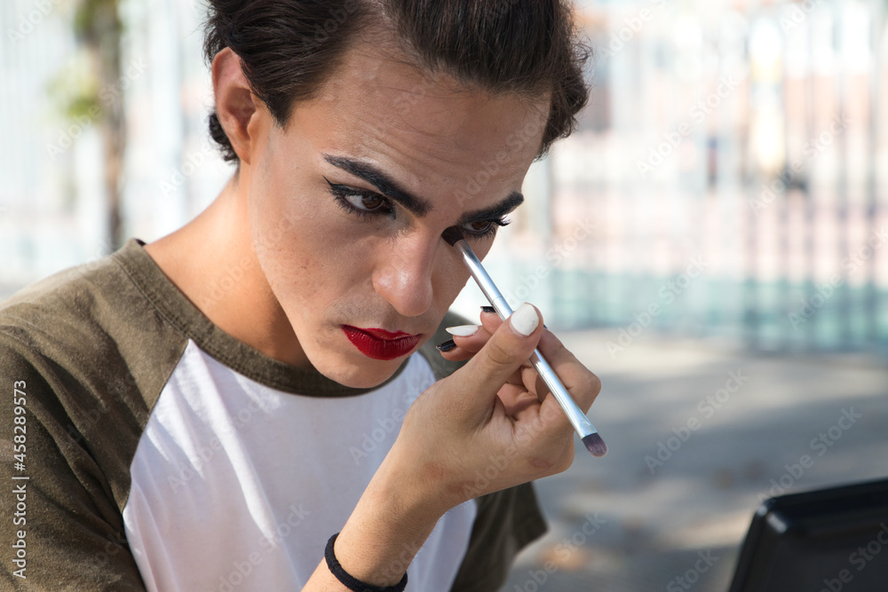 young latina transsexual woman is in a park where she is going to start ...