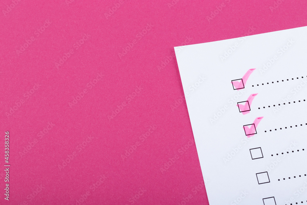 Check list with pink marked points on pink background Stock Photo ...