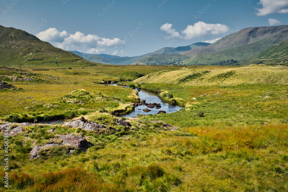 Beautiful landscape scenery of small river in the green valley at ...