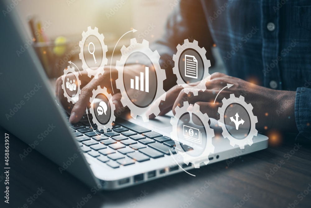 Person working on computer with icons of planning schedule of tasks and ...