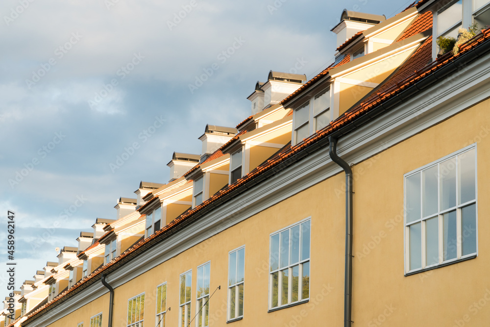 Foto de Stock Attic-type windows of historical buildings complex with ...