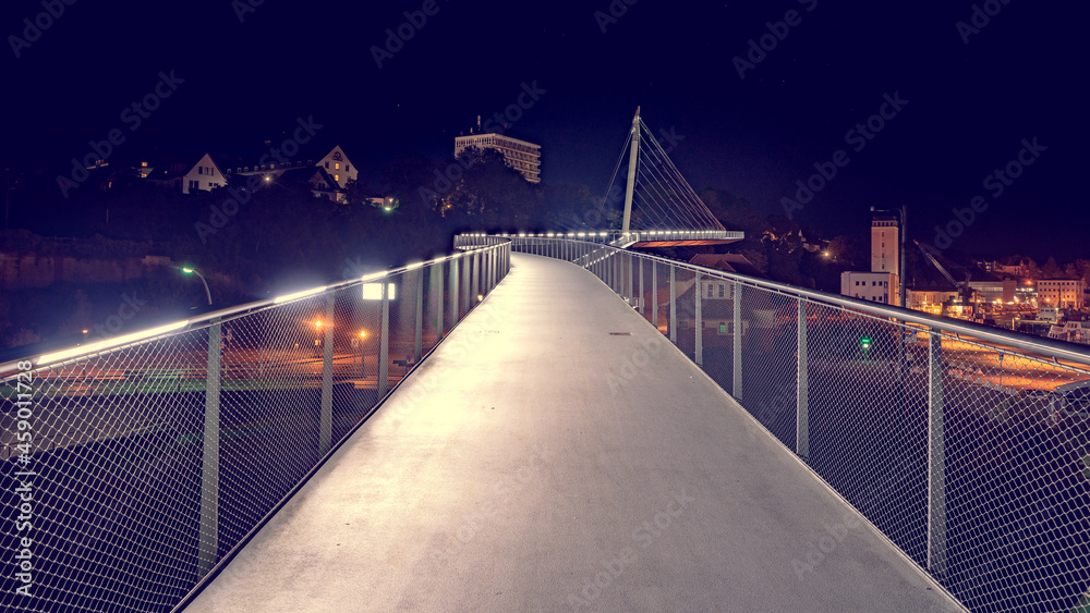 Illuminated pedestrian bridge at night Stock Photo | Adobe Stock