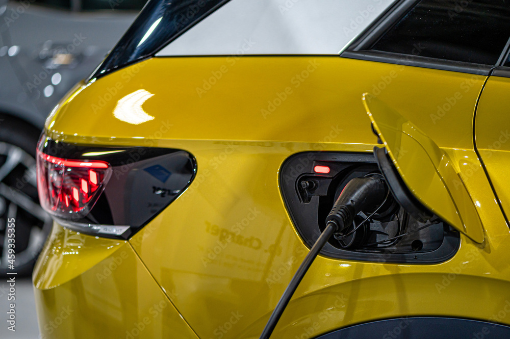 Stock-Foto „vw id4 electric car connected to the charger, eco friendly ...