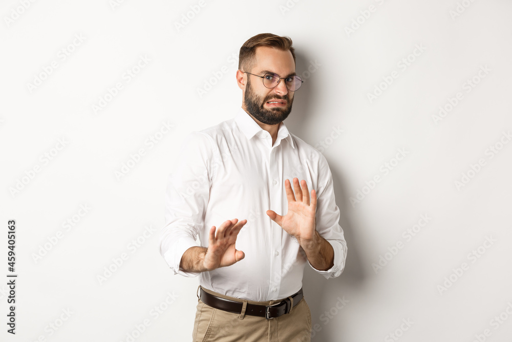 Disgusted businessman rejecting something bad, cringe from aversion ...
