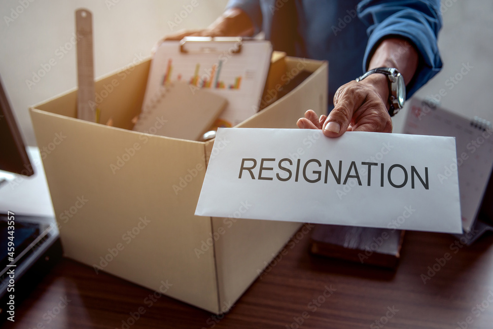 Office worker submits resignation letter after collect office tools and ...