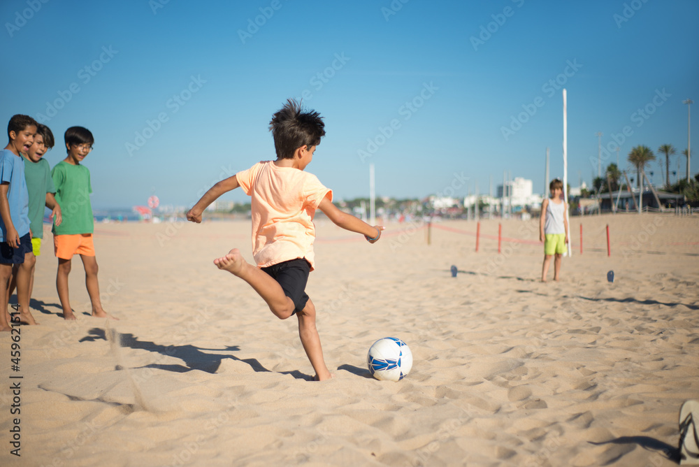 Foto de Stock Multiethnic group of preteen boys playing football on ...