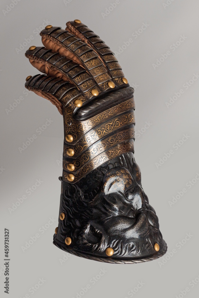 Medieval knightly brown plate gauntlet from Italian armor, in the form ...