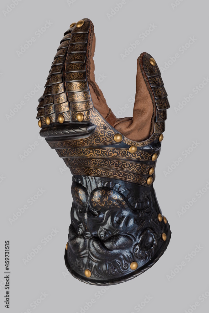 Medieval knightly brown plate gauntlet from Italian armor, in the form ...