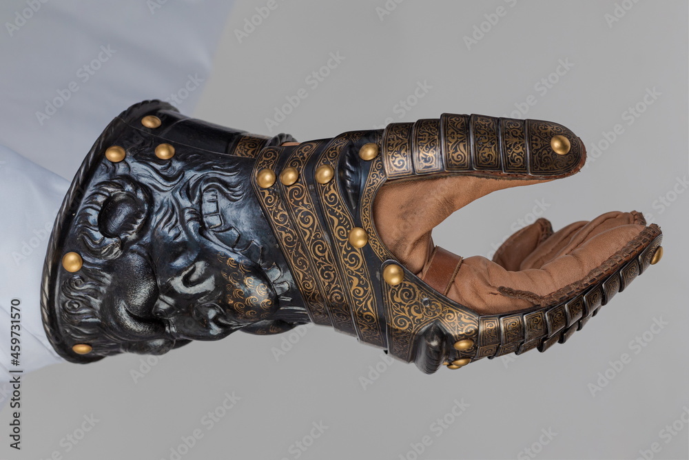 Medieval knightly brown plate gauntlet from Italian armor, in the form ...