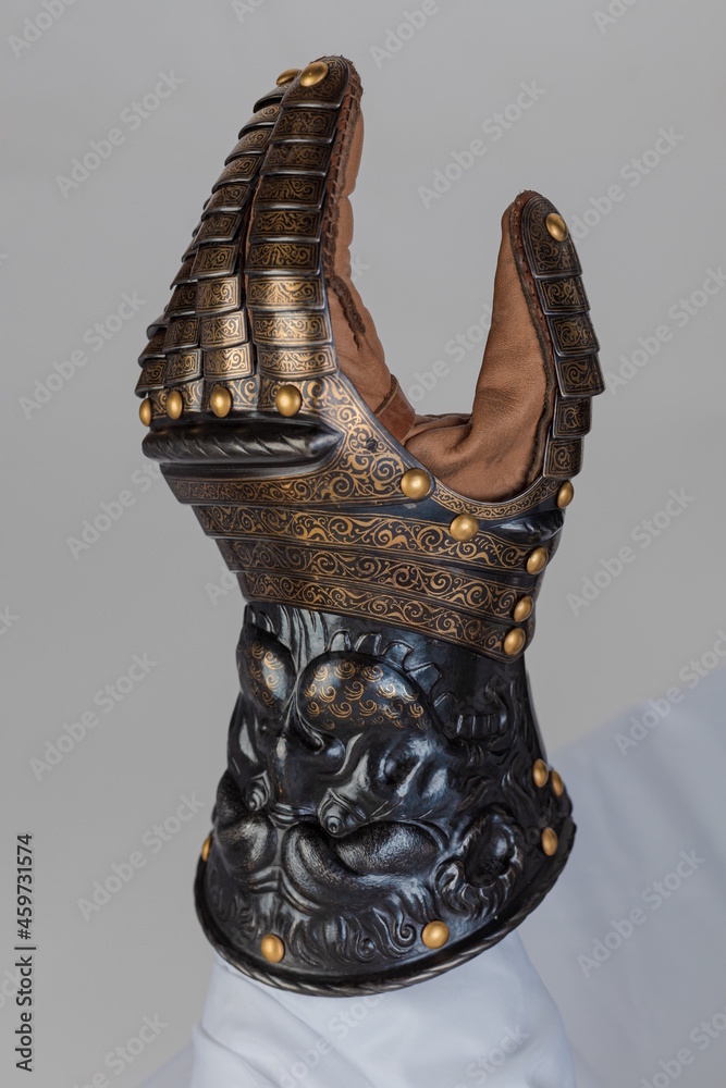 Medieval knightly brown plate gauntlet from Italian armor, in the form ...