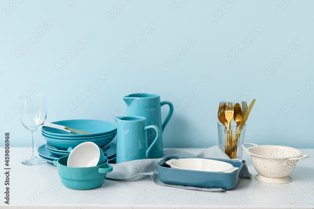 Set of clean dishes on color background Stock Photo | Adobe Stock