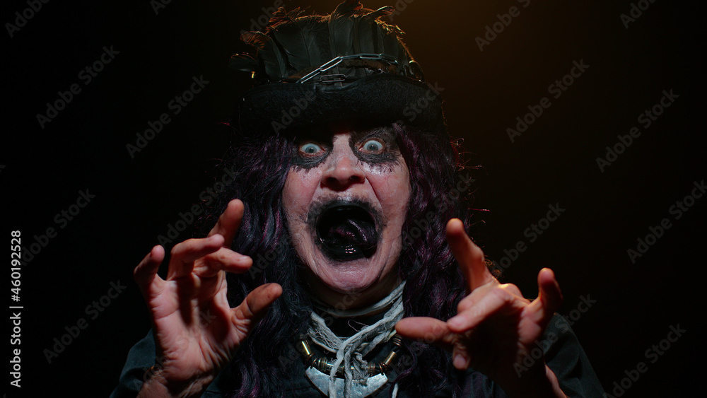 Creepy mature woman grandmother with Halloween stylish witch makeup ...