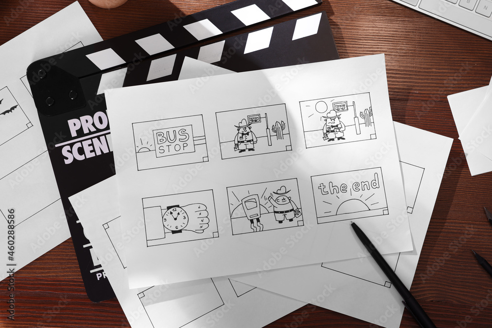 Storyboard with cartoon sketches at workplace, flat lay. Pre-production ...