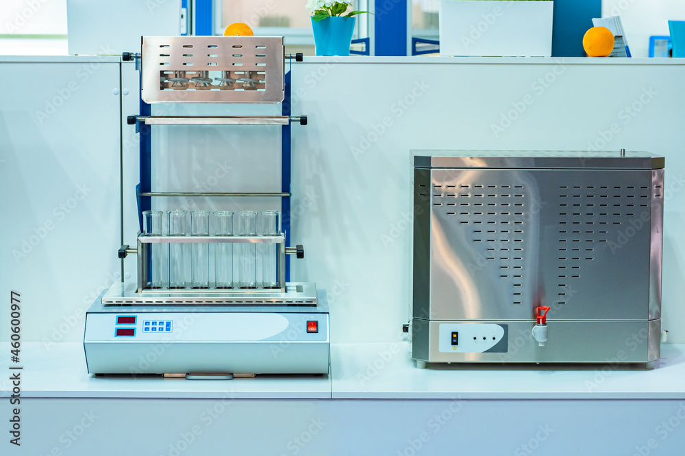 Digestor in medical laboratory. Programmable digestor on table. Protein ...