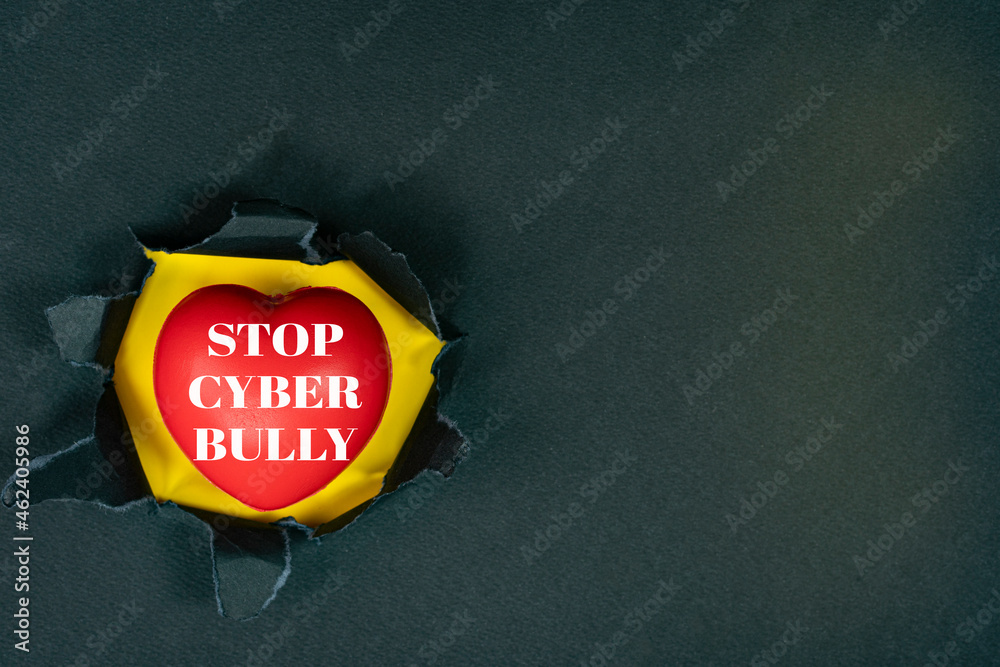 Foto de Stock Layout of torn paper and heart model with text STOP CYBER ...