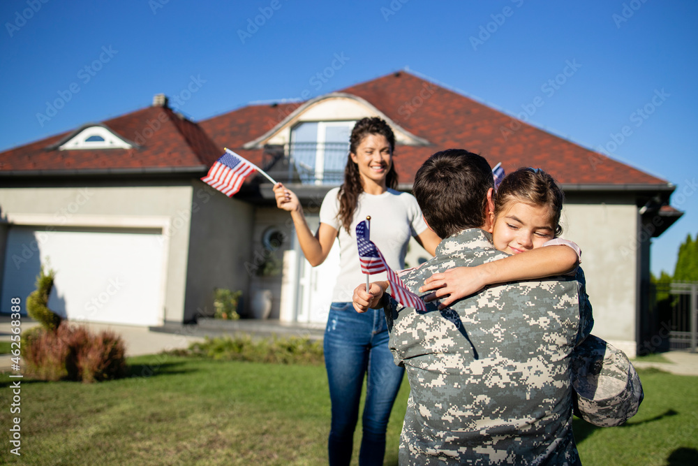 Little girl running to her dad soldier coming home from war and his ...
