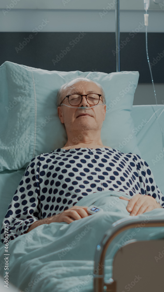 Hospital ward patient sleeping in bed at medical unit connected to ...