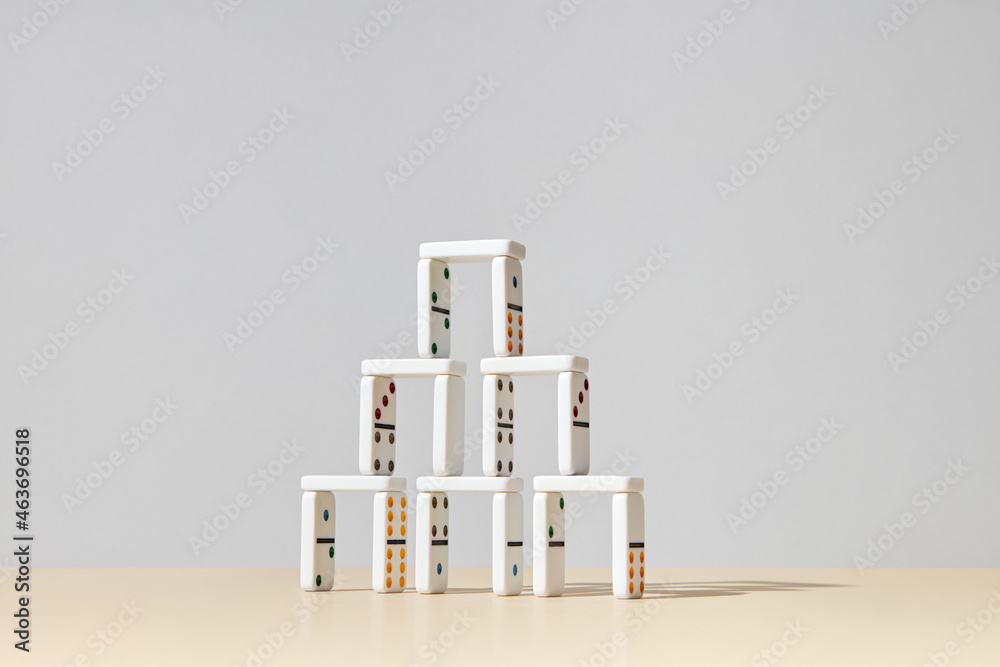 Domino pyramid Stock Photo | Adobe Stock