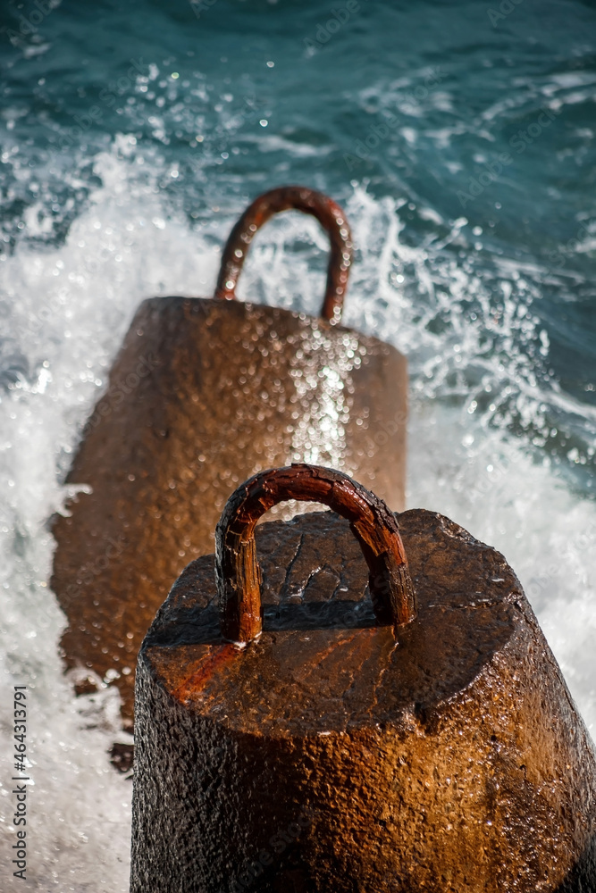 Strengthening the shore from erosion with concrete tetrapods. The ...