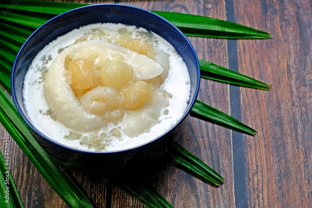 Sweet sticky rice with longan and coconut sliced in coconut milk (Kao ...