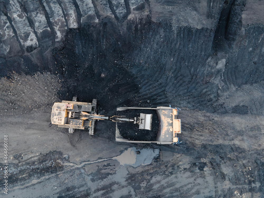 coal mining, top view aerial. Industrial zone. loading coal into trucks ...