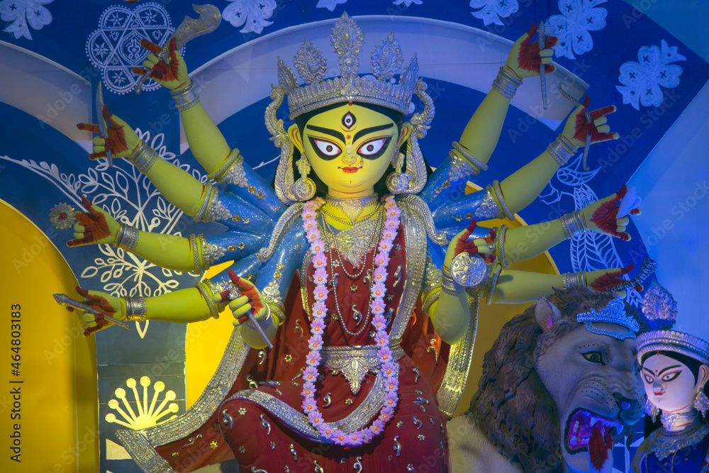 Goddess Durga idol at decorated Durga Puja pandal, shot at colored ...