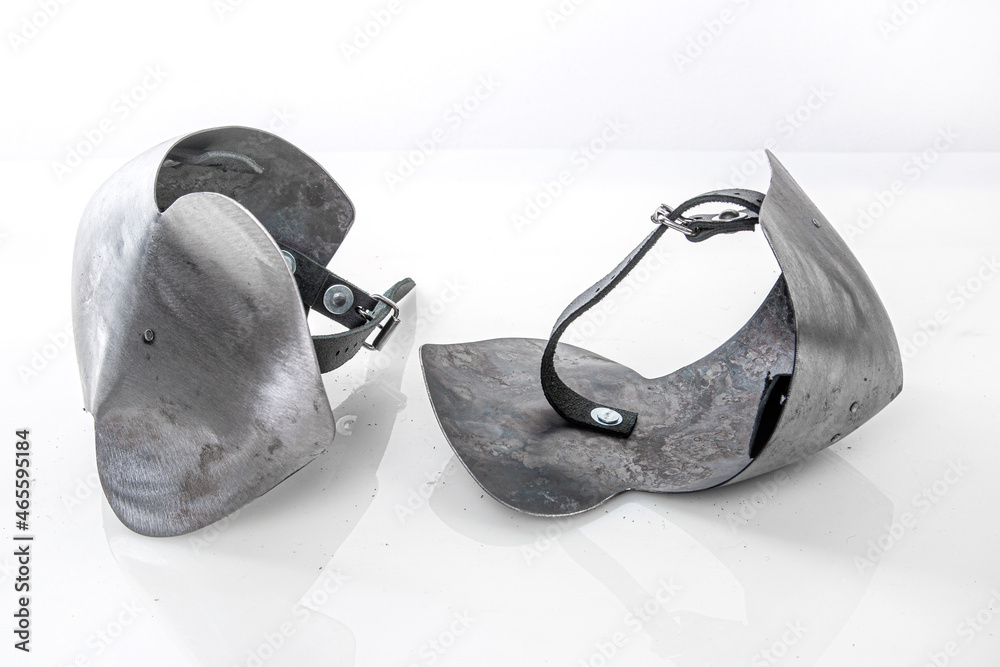 Steel metal knee pads to protect feet. Iron steel ammunition, personal ...