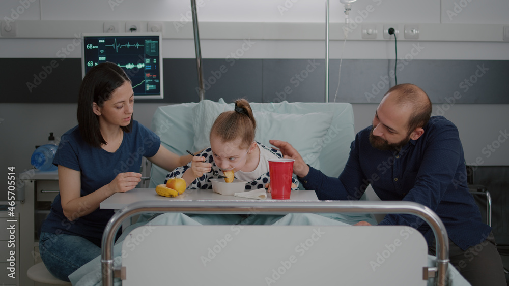 Stock-Foto „Family sitting with sick girl daughter while eating healthy ...
