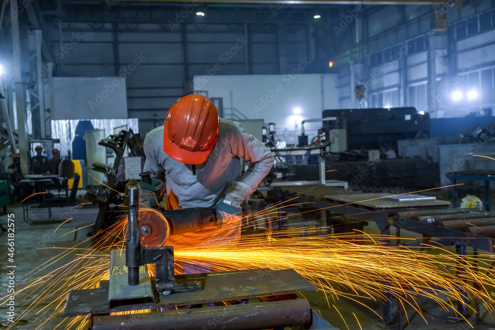 Rotation of the angle grinder disc during operation. Bright sparks from ...