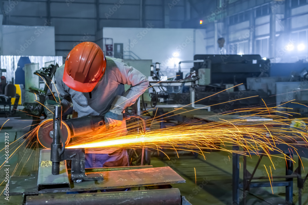 Rotation of the angle grinder disc during operation. Bright sparks from ...