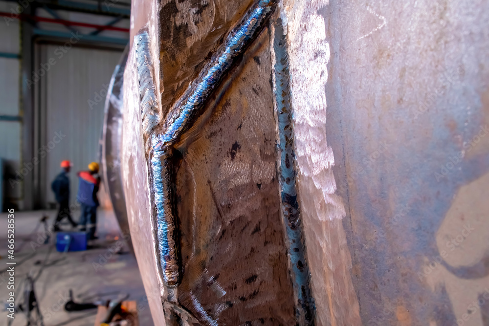 Vertical welding seam made by electric arc welding. MMA welding. Stock ...