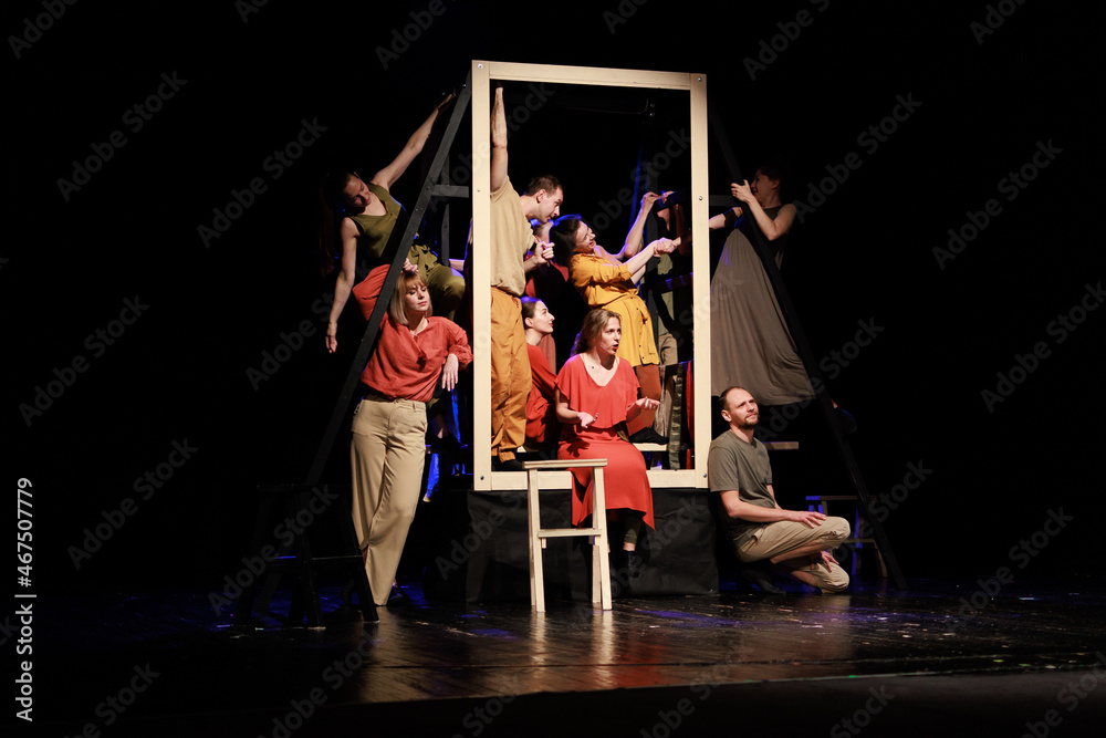 Actors and actresses perform a modern performance on the stage of the ...