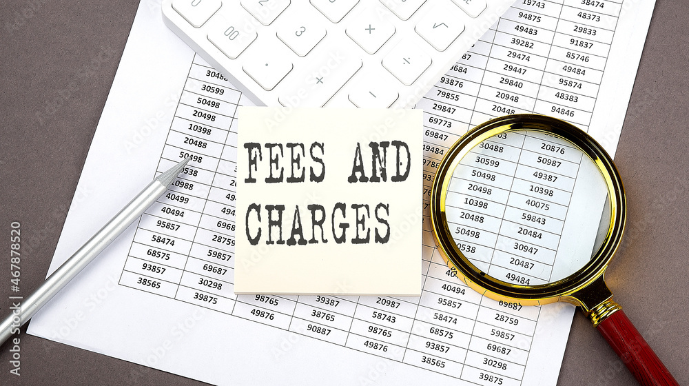 FEES AND CHARGES text on sticker on the chart ,with calculator and ...